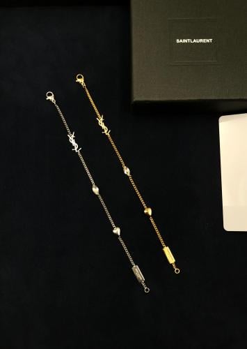 Saint Laurent Opium bracelet in silver and gold with the brand's logo ...